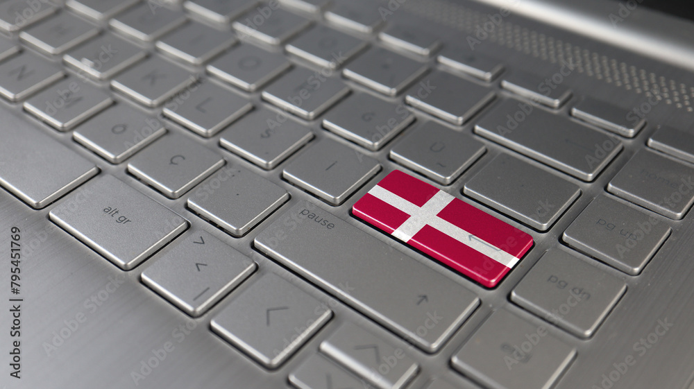 Keyboard with Denmark flag on the enter button, represents cyber attack ...
