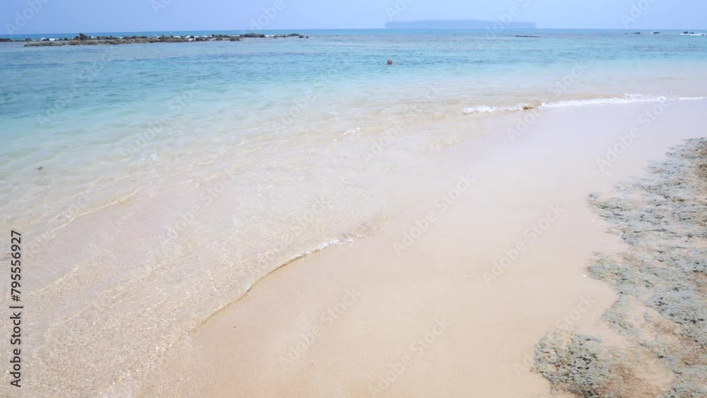 Middle aged woman floating swimming effortlessly in the pristine azure ...