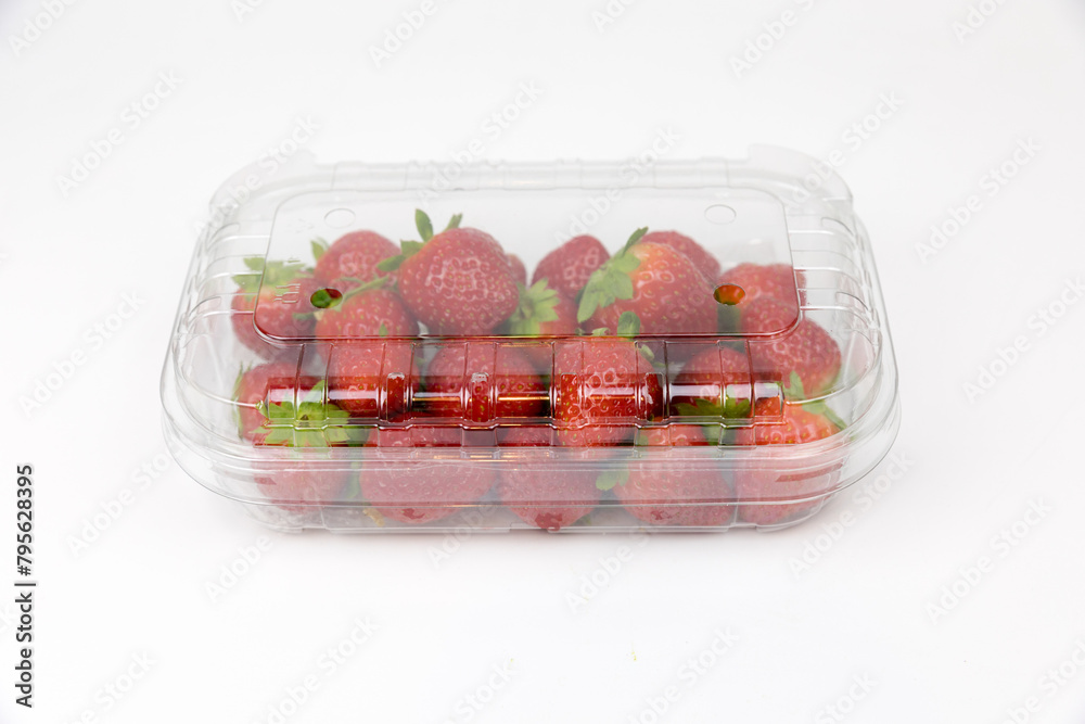 disposable plastic containers and lids on a white background ...