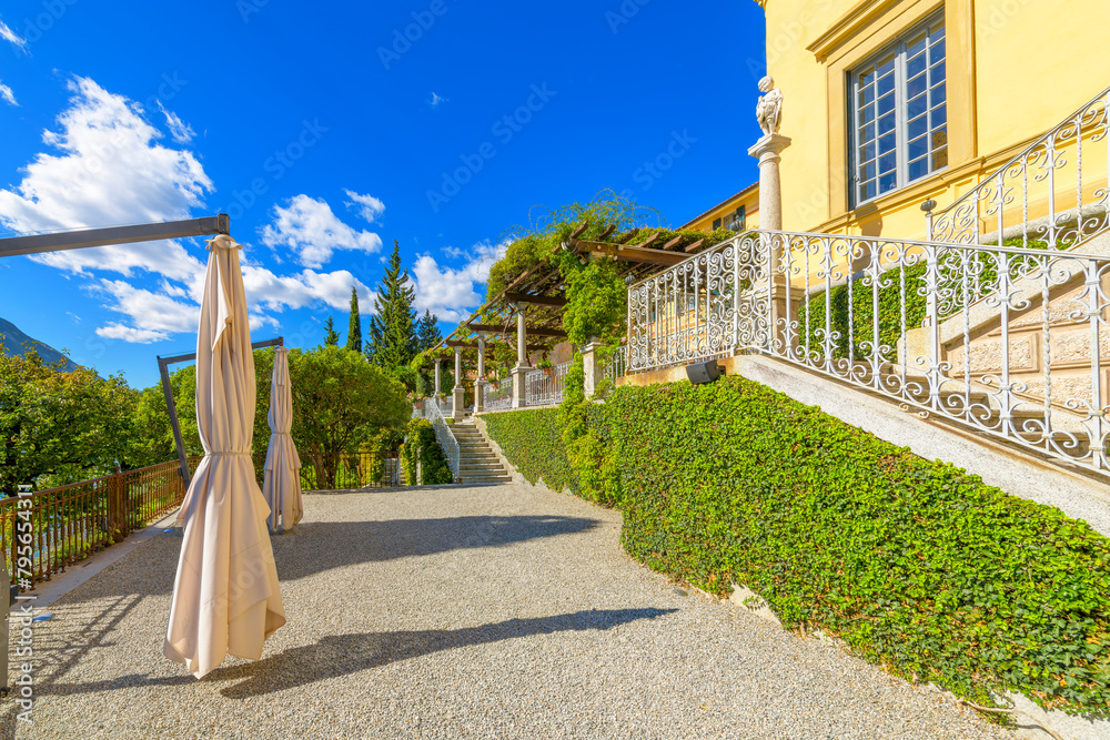 Formal gardens and courtyard outside a luxury Italian villa on the ...