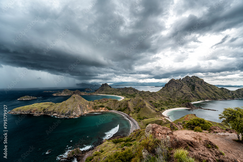 Image of incoming rain storm passing over Padar island with beautiful ...