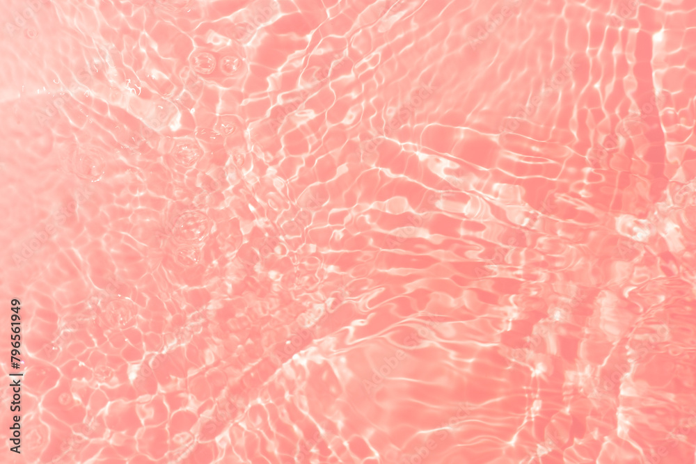 Pink water bubbles on the surface ripples. Defocus blurred transparent ...