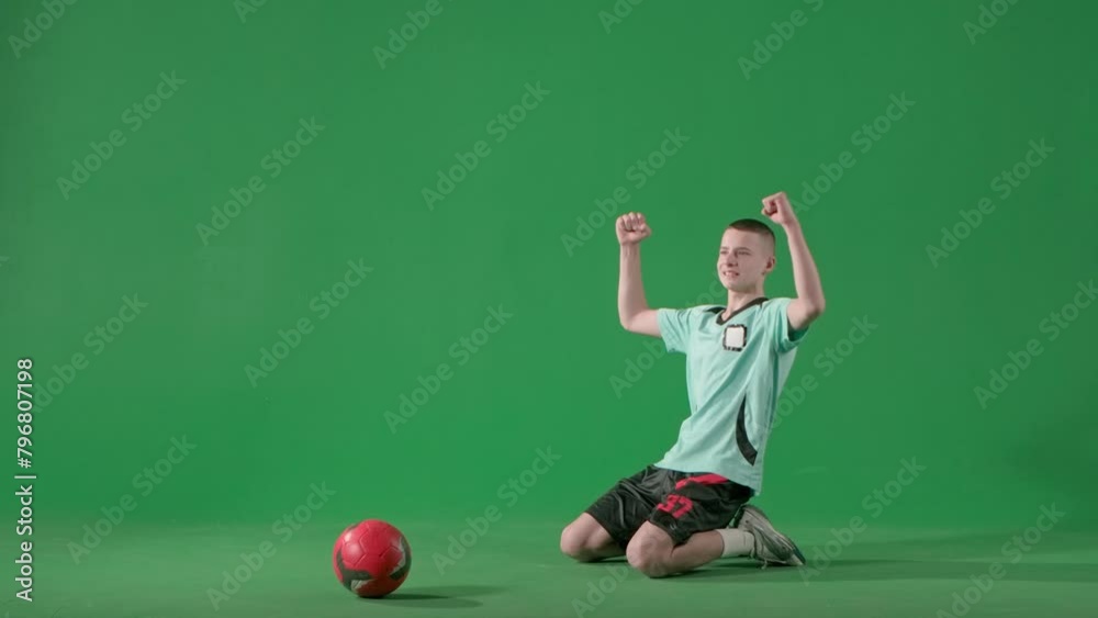 Soccer player on chroma key green screen background. Man professional ...