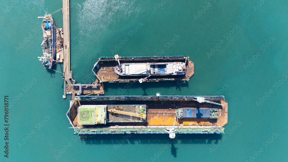Dry dock with Cargo Ship maintenance or repair at floating dock in ...