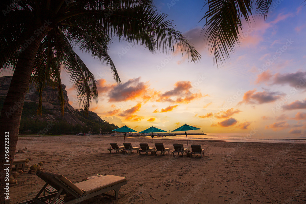 Beaches and sun tables in Thailand,Row of empty sun loungers and orange ...