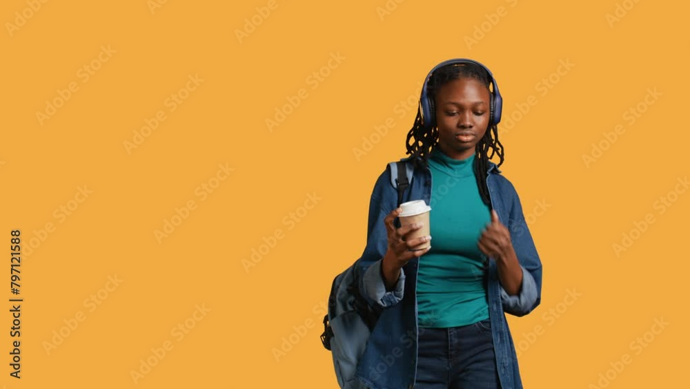 Young girl with backpack and headphones yawning, feeling tired ...