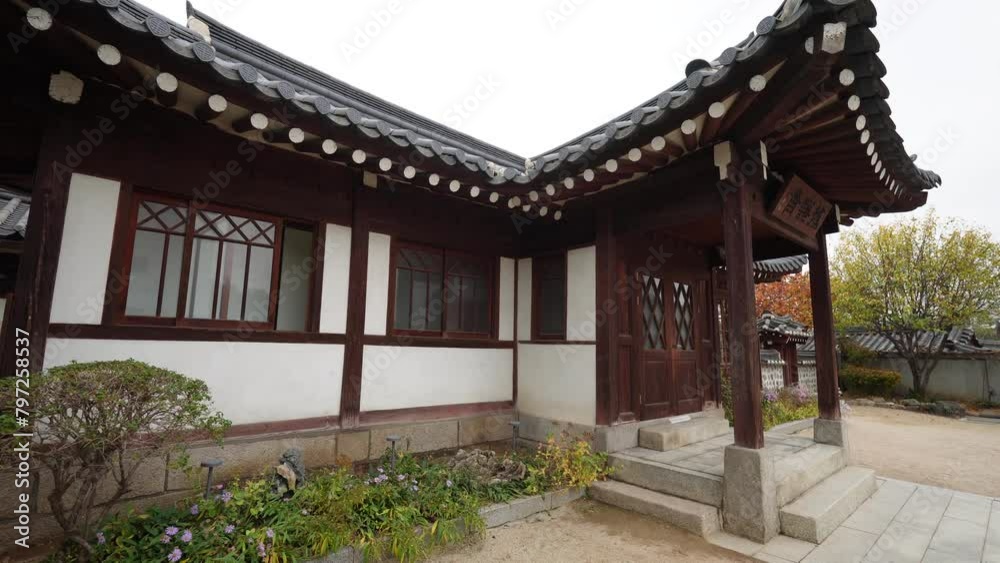 traditional Korean house, known as a Hanok, with tiled roofs, wooden ...