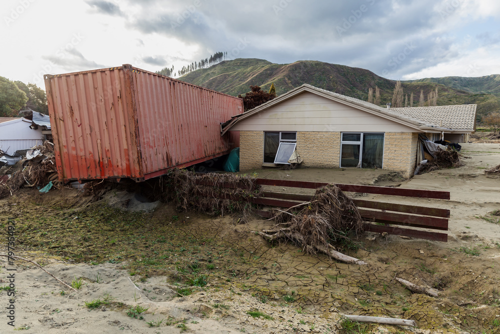 Silt, shipping container and house buried and damaged in the Cyclone ...