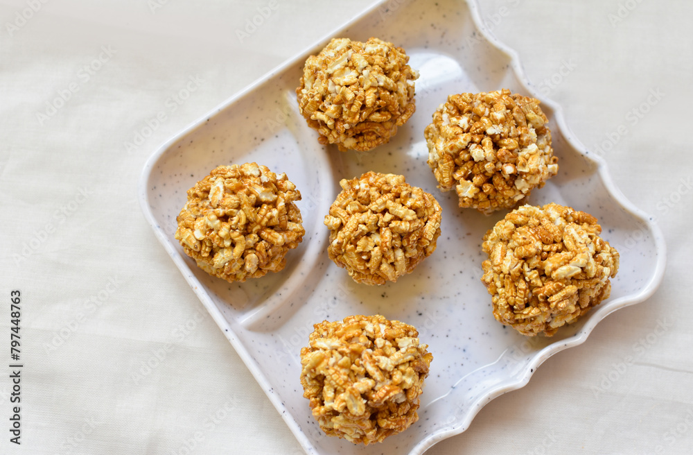 Bengali Traditional Puffed Rice Balls is a sweet made using puffed rice ...