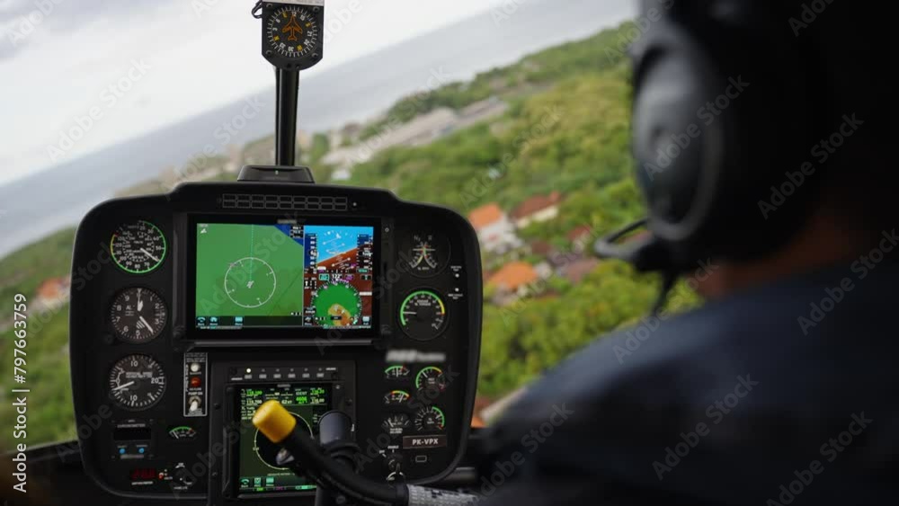 Helicopter flying, view from cabin behind the pilot. Aircraft cockpit ...
