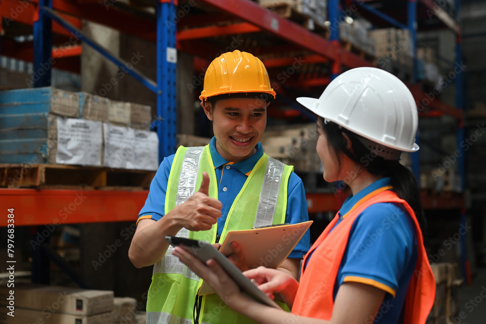 Warehouse worker giving a thumbs up to co-workers, Praise, and ...