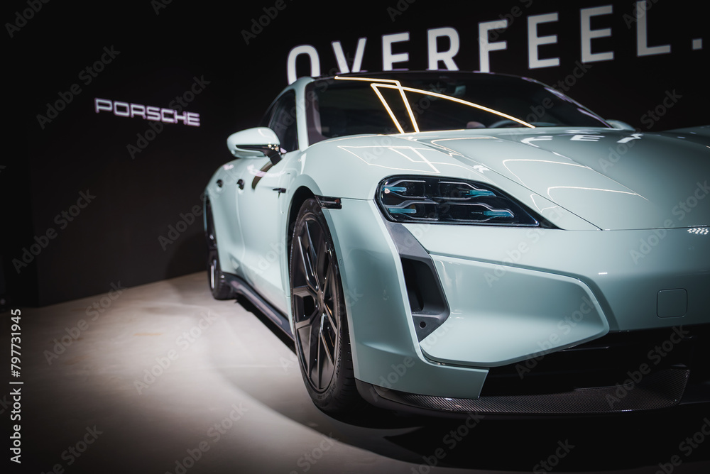 Luxury blue Porsche sports car on display at an upscale event ...