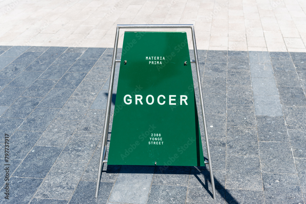stylish contemporary sidewalk sign board outside Stock TC Grocer, a ...