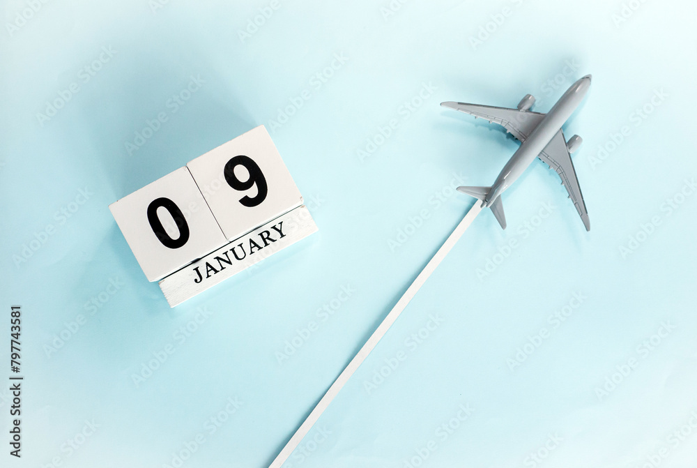 January calendar with number 9. Top view of a calendar with a flying ...