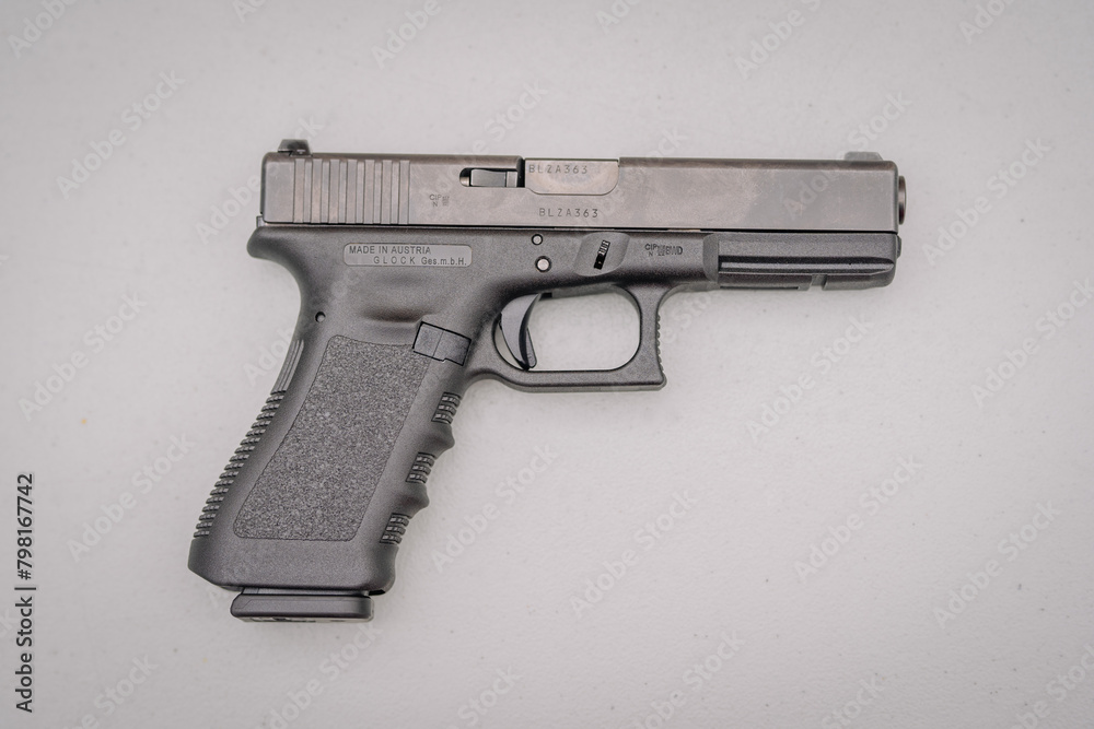 Dobele, Latvia - August 18, 2023 - A Glock pistol on a plain background ...