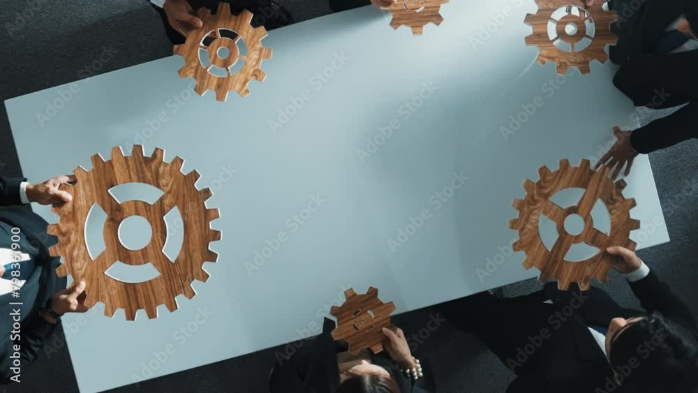 Top view of smart business people gather wooden cog together at meeting ...