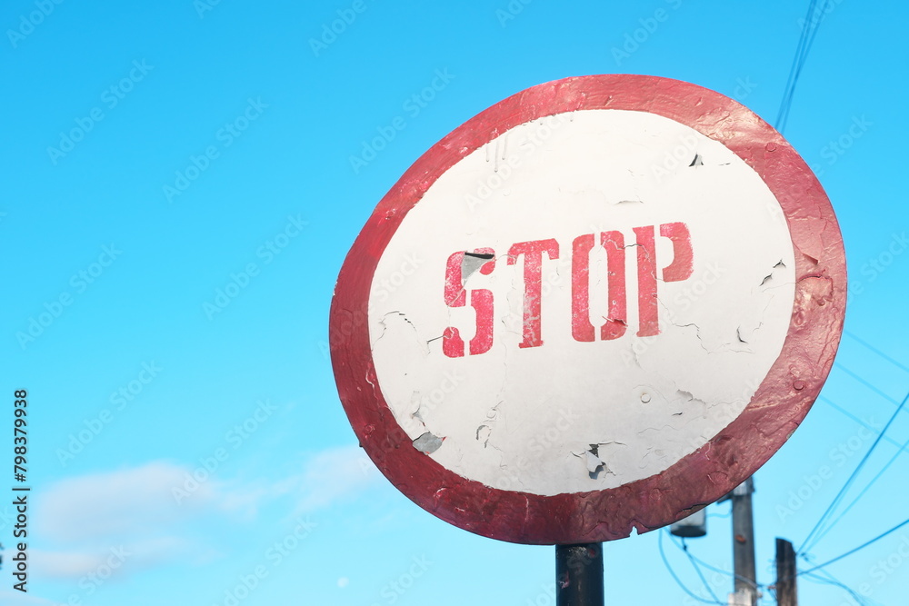 Circular red stop sign road warning against clear blue sky. Stock Photo ...