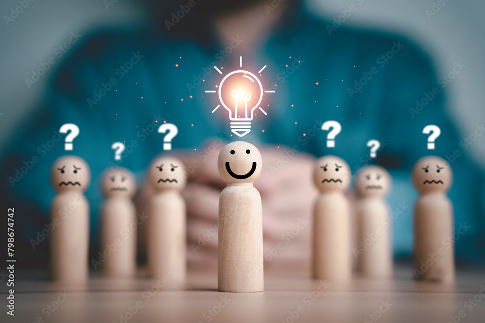 Smile figure with glowing lightbulb in front of sad figure with ...