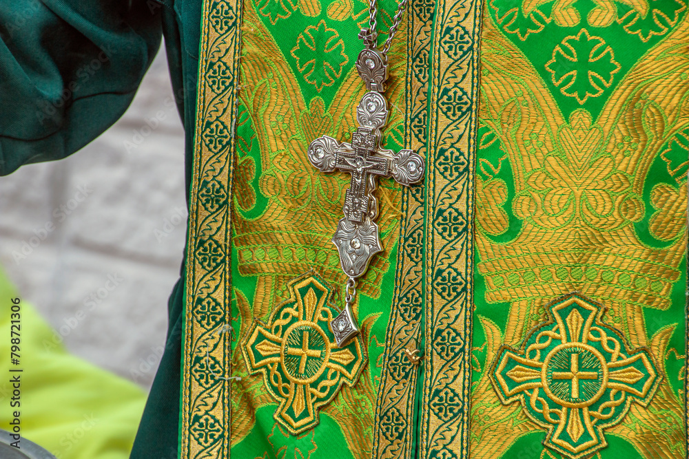 Holy cross on the chest of a priest in a green cassock Stock Photo ...
