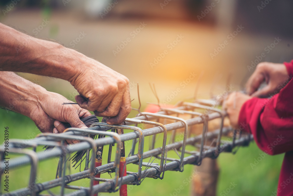 Construction Worker hands using pincer pliers iron wire. Outdoor Worker ...