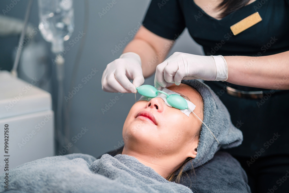 surgeon putting goggles cover woman eye for treatment. asian patient ...