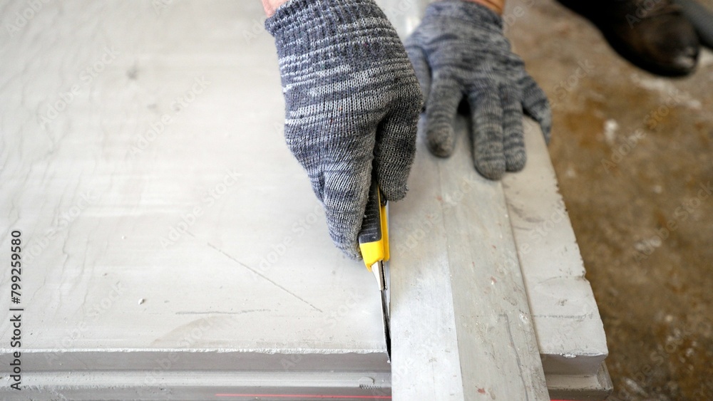Cutting concrete block. Sawing a concrete slab with a hacksaw, medium ...