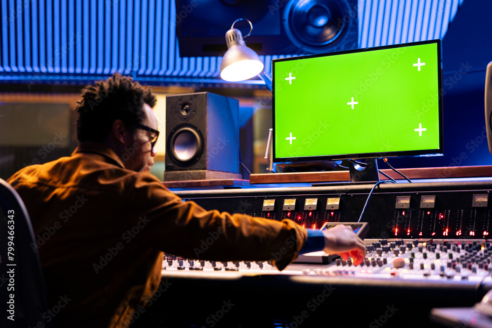 African american producer editing music on console with isolated ...