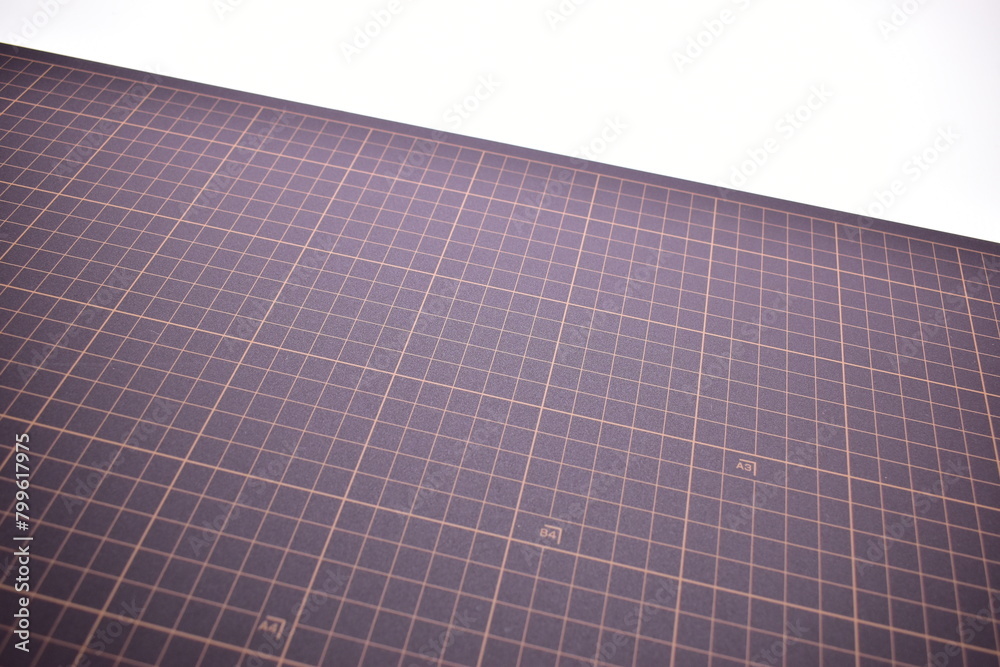 black cutting mat board on white background with line and scale measure ...