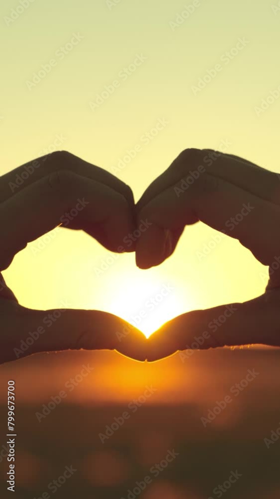 girl shows hand sign heart gesture sunset, feminine woman love travel ...