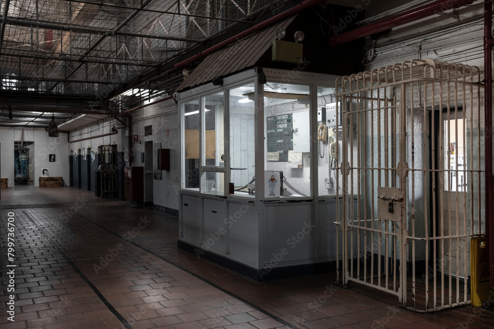 Geelong Gaol interior with staff room next to a security cage and cell ...