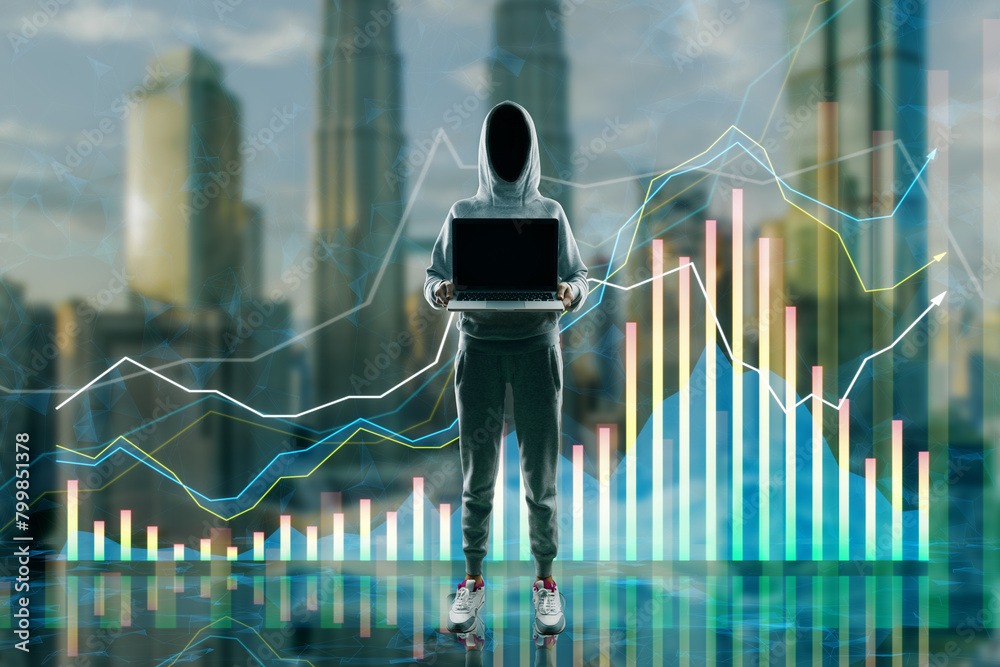 Hacker in hoodie holding laptop with growing forex chart on blurry city ...