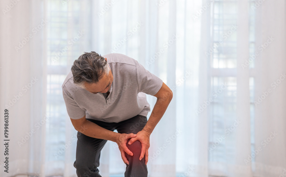 Sick unhappy senior adult elderly asian man touching her muscle injury ...