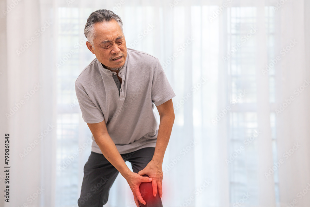 Sick unhappy senior adult elderly asian man touching her muscle injury ...