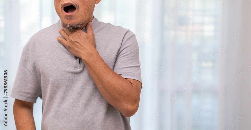 Sick senior man touching neck unwell coughing with sore throat pain ...