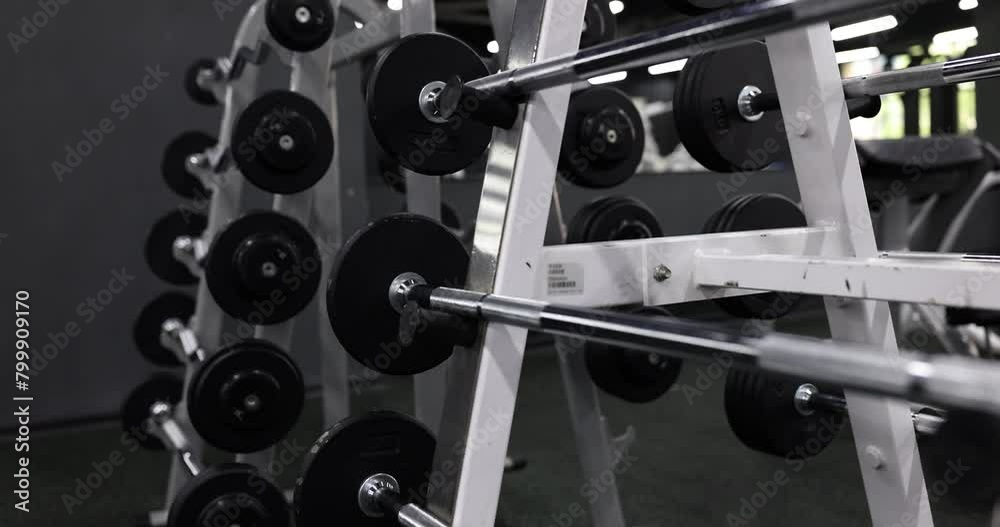Vidéo Stock Barbells with weights for athletes in modern sports club ...