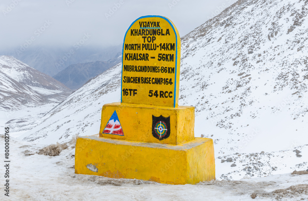 Sign marking the summit of Khardung La pass, at 17,582 feet one of the ...
