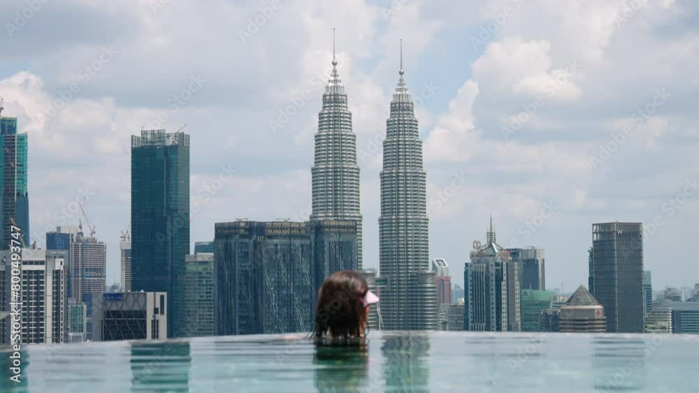 Infinity Pool In The Rooftop Of A Hotel With Petronas Twin Towers In ...