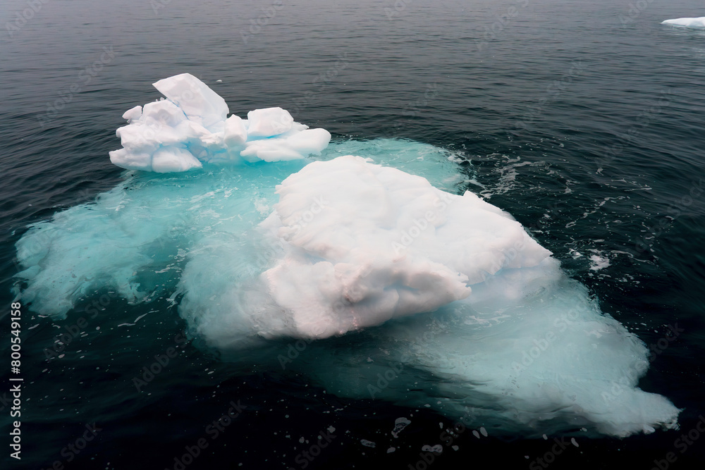 floating iceberg partially submerged with aqua ice in Greenland Stock ...