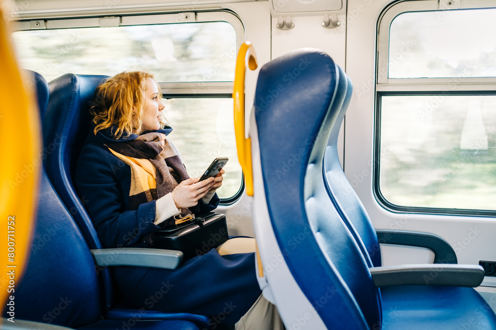 Transport concept. Young woman passenger look at the window smile and ...