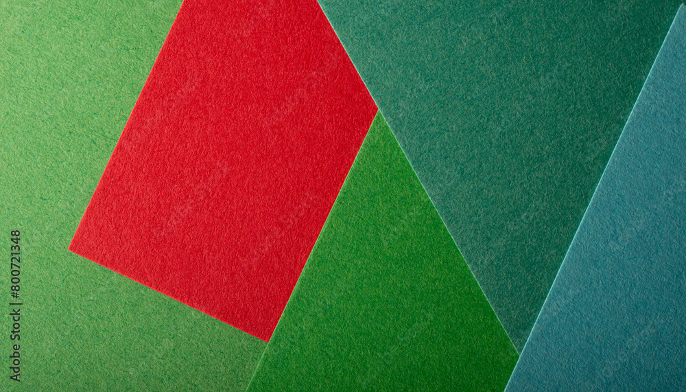 colored paper with texture for background. green and red paper with ...