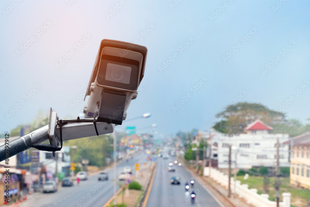 ip cctv camera installed on high metal post beside the road to do ...