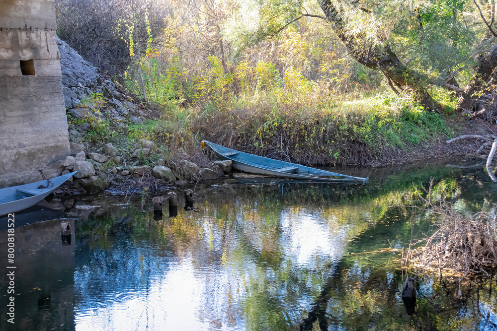 Panoramic idyllic view of broken sunken boat boats floating on Crmnica ...