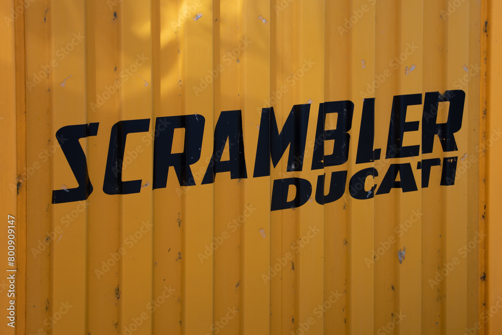 Ducati Scrambler yellow wall detail motorcycle sign logo and text brand ...