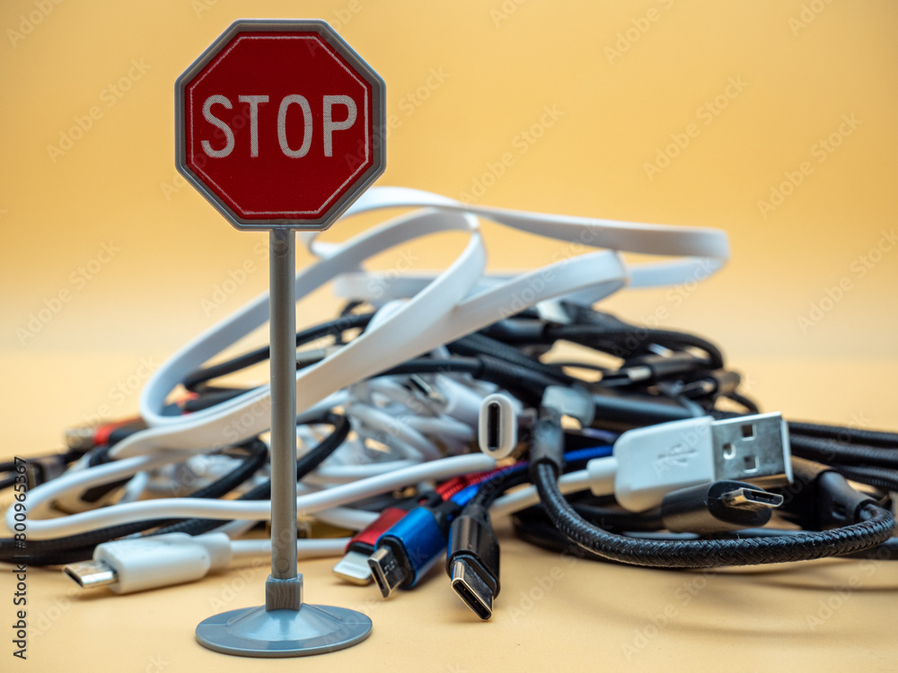 pile of tangled old smart technology wires, used charging cables and ...