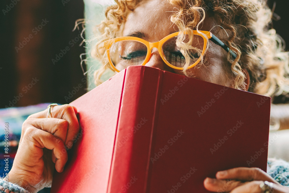 Woman relax and pleasure expression about reading a book novel alone at ...