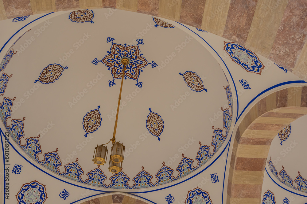 The traditional Chechen ornament "bustam" on the arches of the summer ...