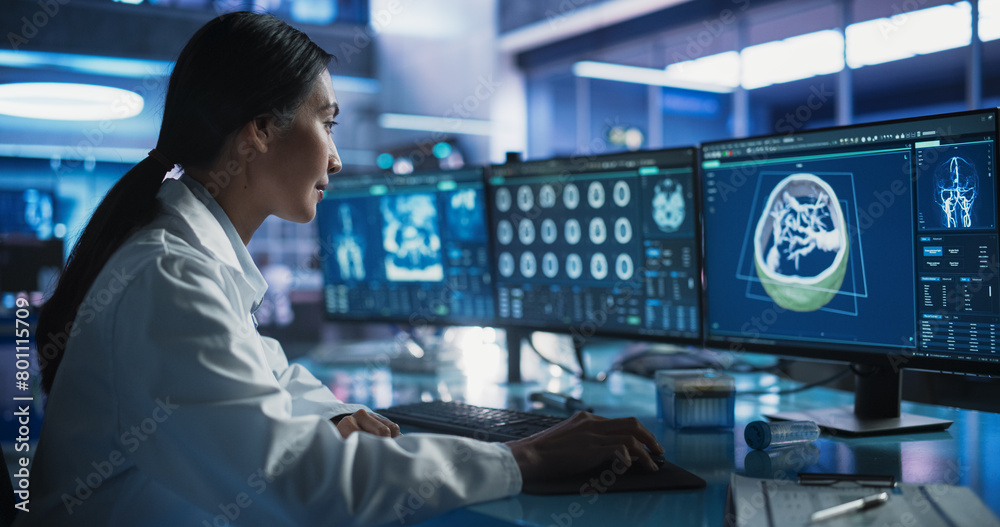 Female Asian Neurologist Using Desktop Computer With Human Brain MRI Scans In Modern Medical ...