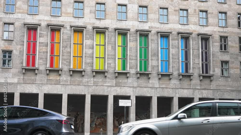 Colorful bi symbol hang finance ministry window. Vivid rainbow flag ...