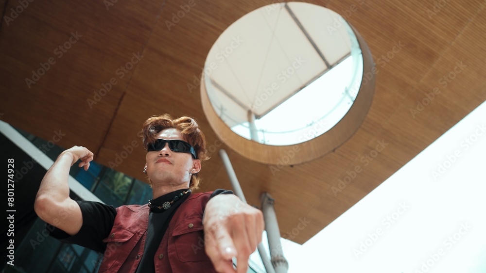 Modern dancer posing at camera with confident with low angle camera ...