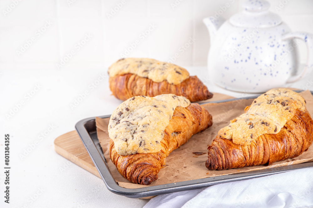 Trendy French sweet dessert pastry crookie, a hybrid of croissant with ...